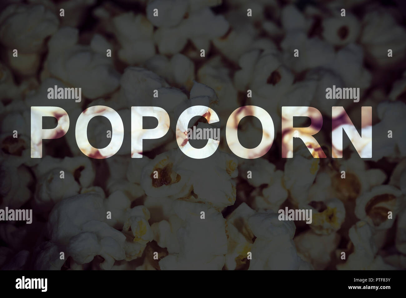 delicious popcorn with inscription popcorn, background image close-up ...