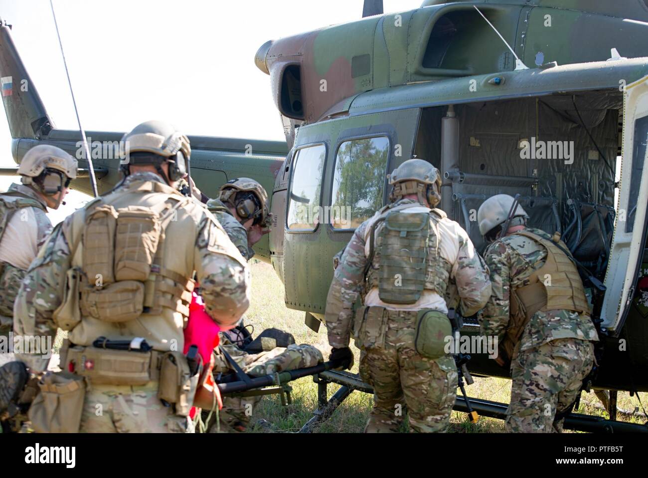 Hungarian special operations forces load a simulated casualty into a ...