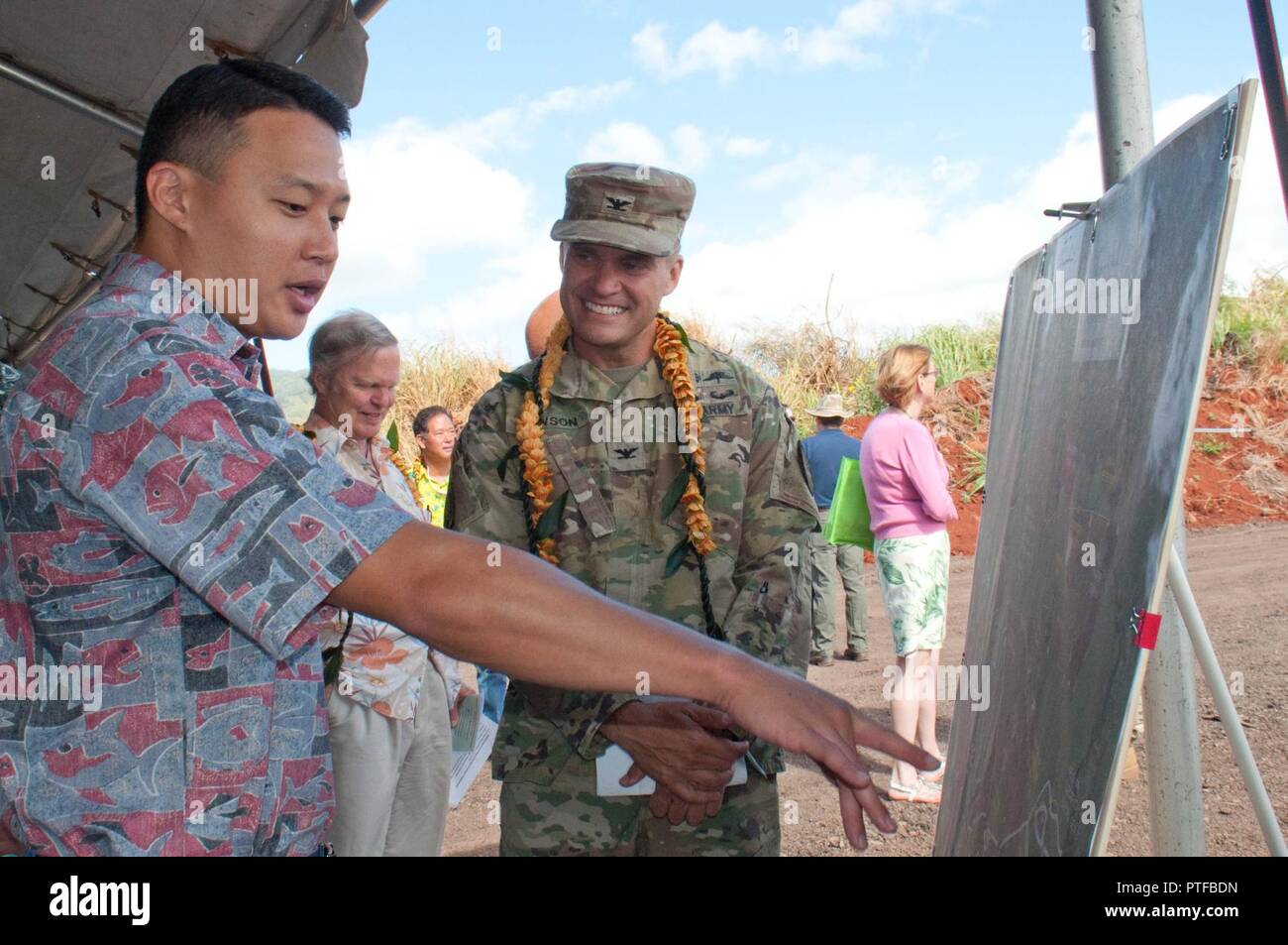 WAHIAWA, Hawaii — David Cho (left), a legislative aid with Sen. Donovan ...