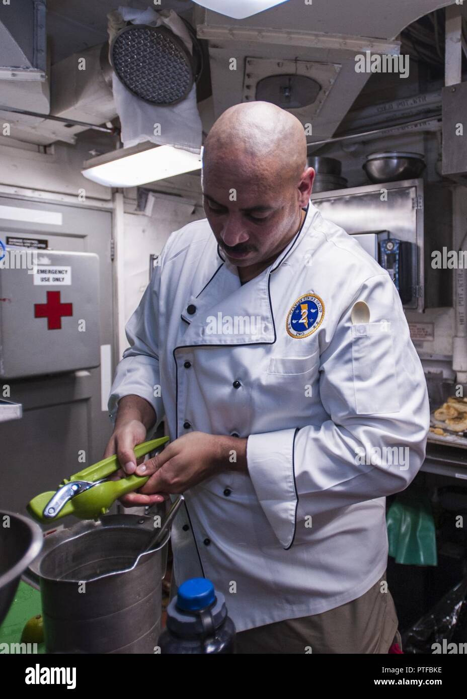 MEDITERRANEAN SEA (July 21, 2017) Cmdr. Calvin Bumphus squeezes lemons ...