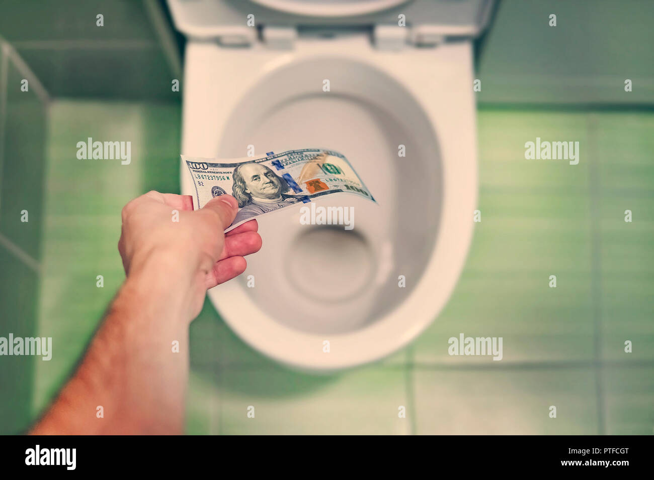 Flush money down the toilet hi-res stock photography and images - Alamy