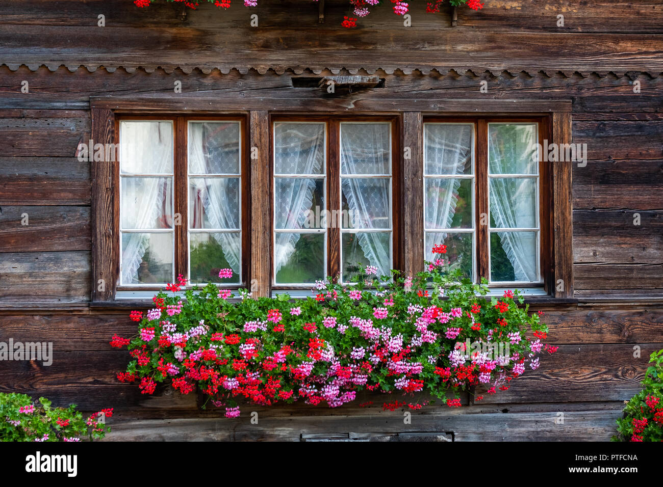 Typical Switzerland wooden house windows Stock Photo - Alamy
