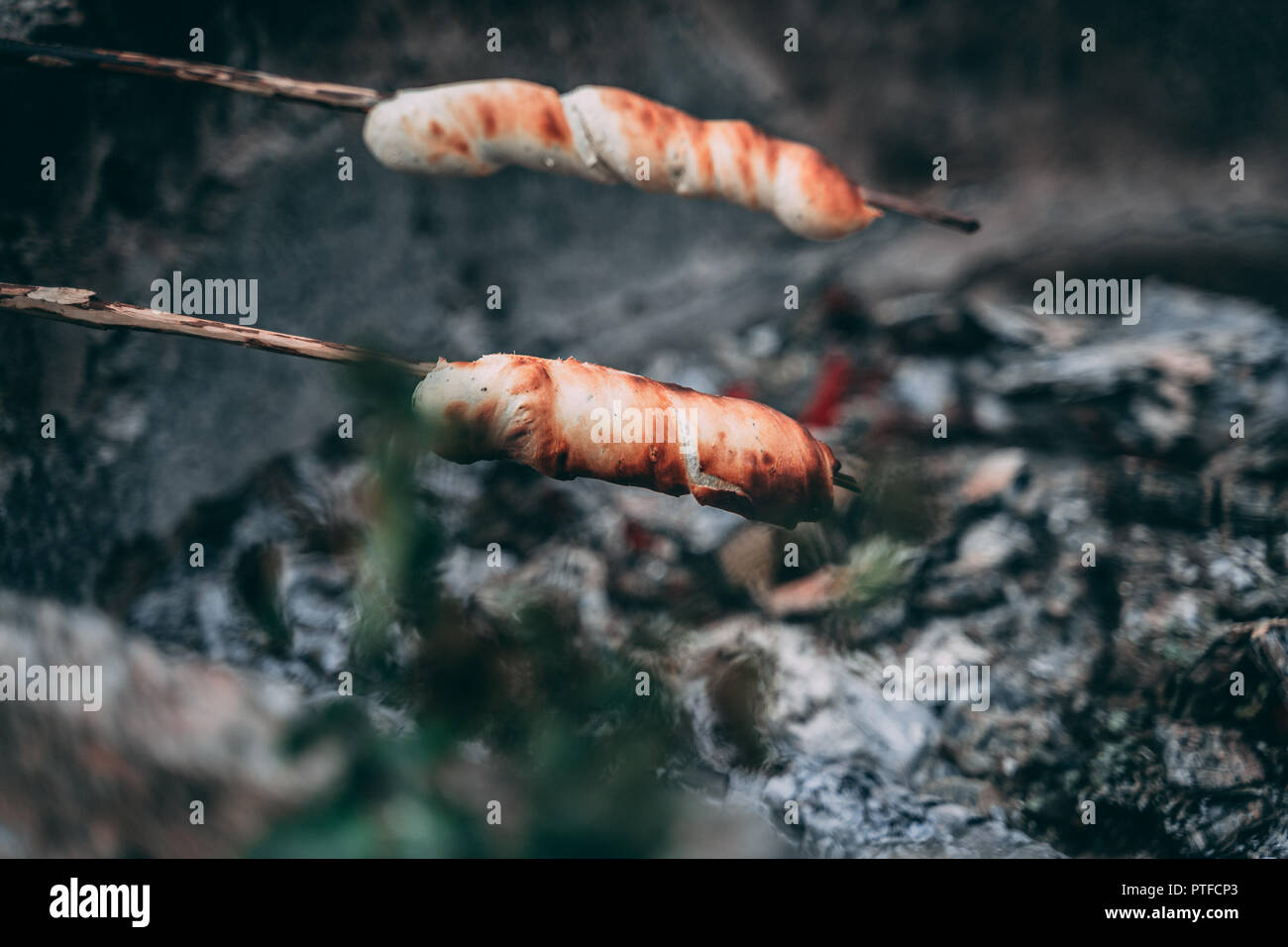 Stockbrot on stick Stock Photo - Alamy