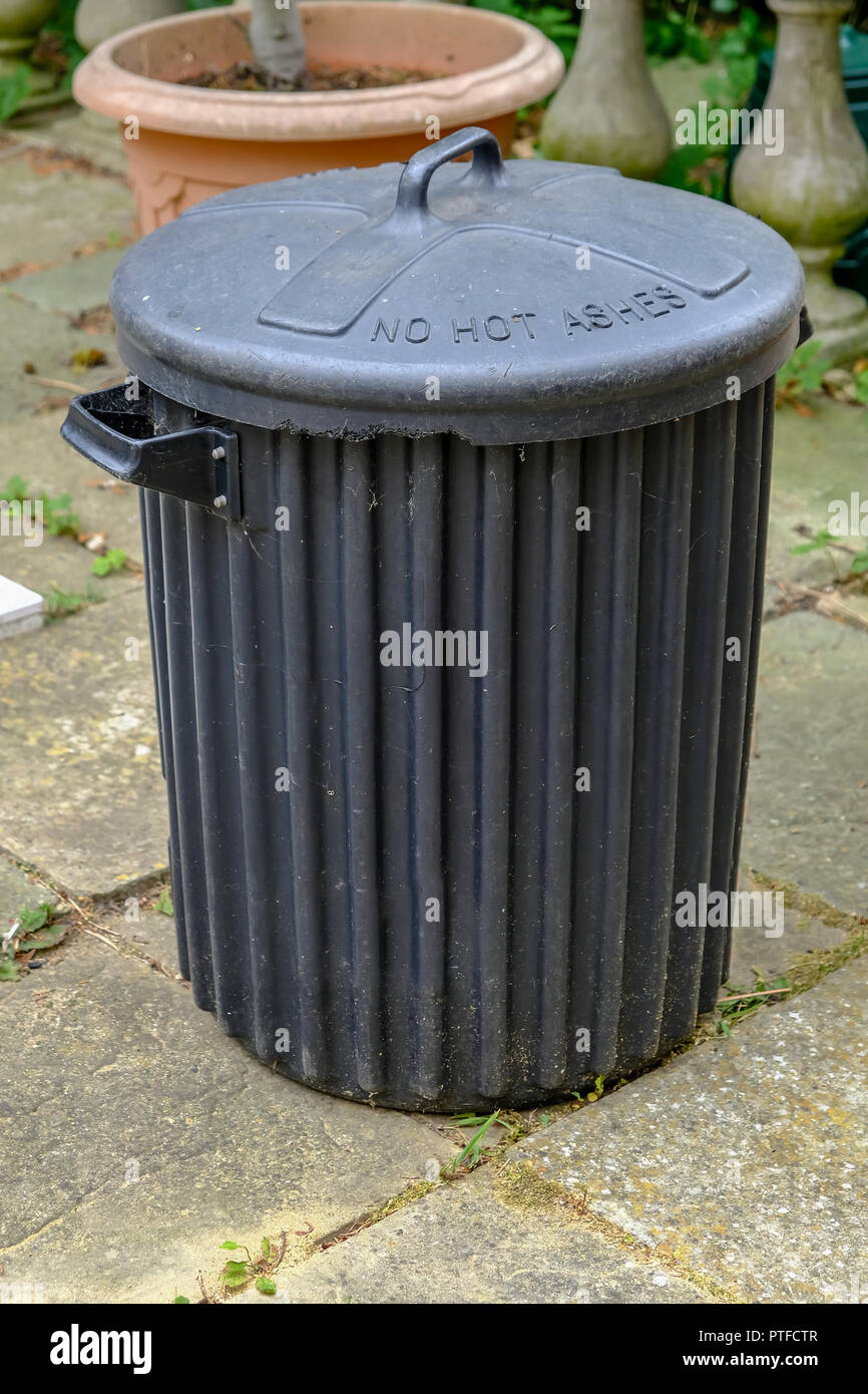 Old black bin made of fibreglass. Looks grundgy and has the lid in ...