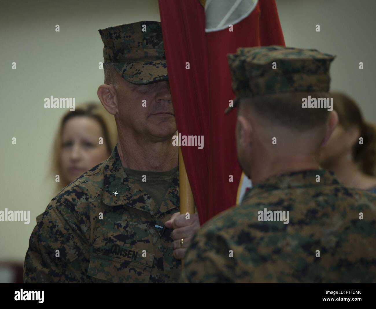 Brig. Gen. John M. Jansen passes the unit colors to Brig. Gen. Chris A ...
