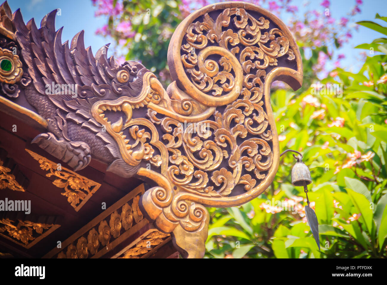 Beautiful craved naga pattern on the rafter and gable of the Thai's ...