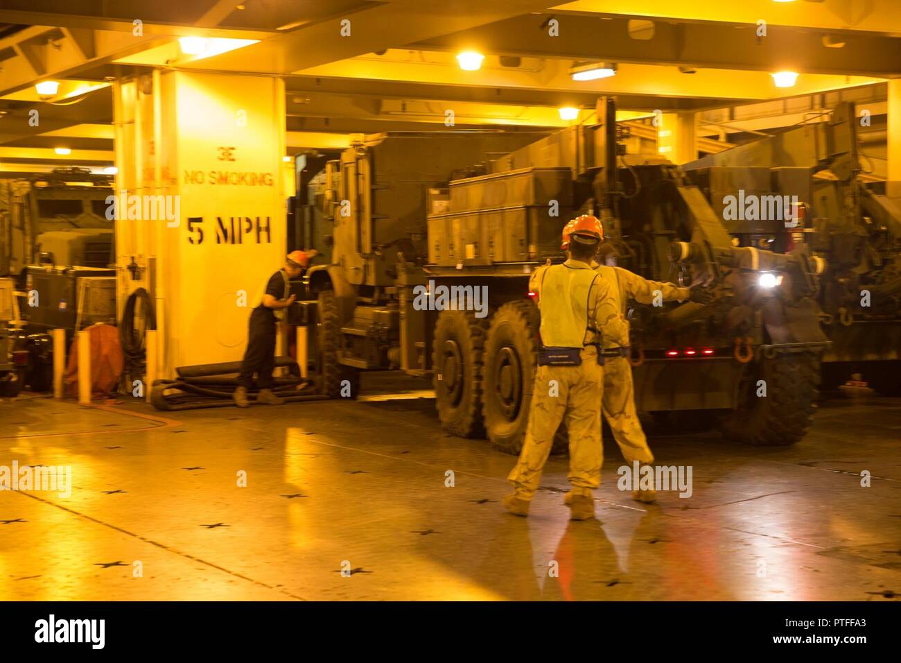 US Marines with 1st Marine Logistics Group guide a Medium Tactical ...