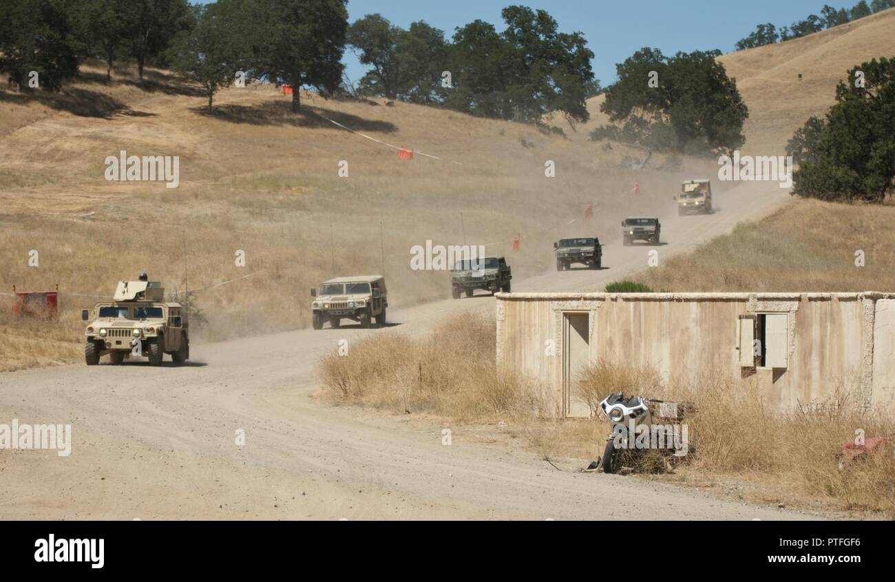 A column of vehicles from the 344th Military Police Company, 485th ...