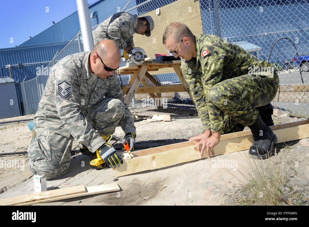 Oregon Air National Guard Master Sgt. Travis McDaniel, (left) assigned ...