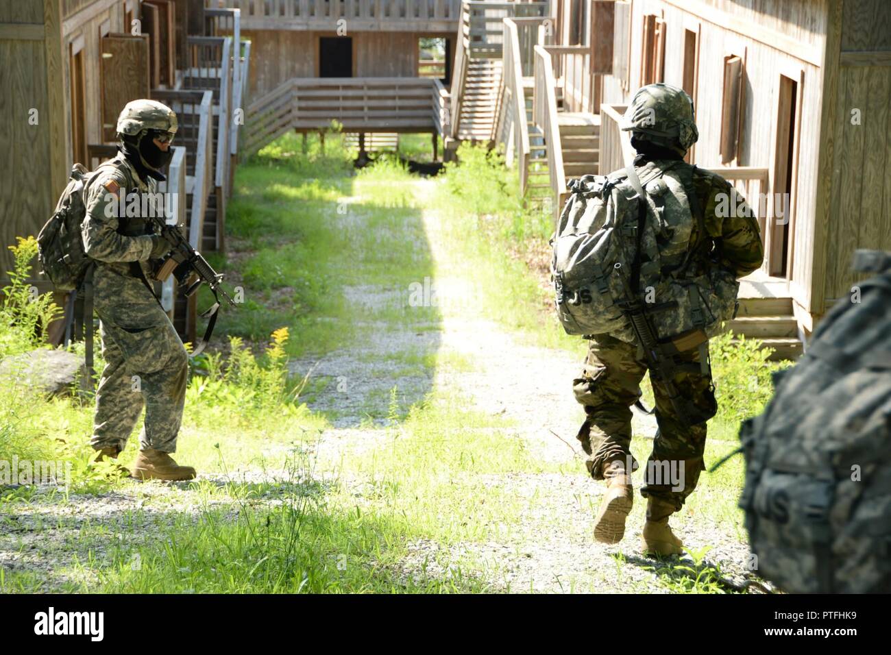 N.Y. Army National Guard Soldiers move through a village in a field ...