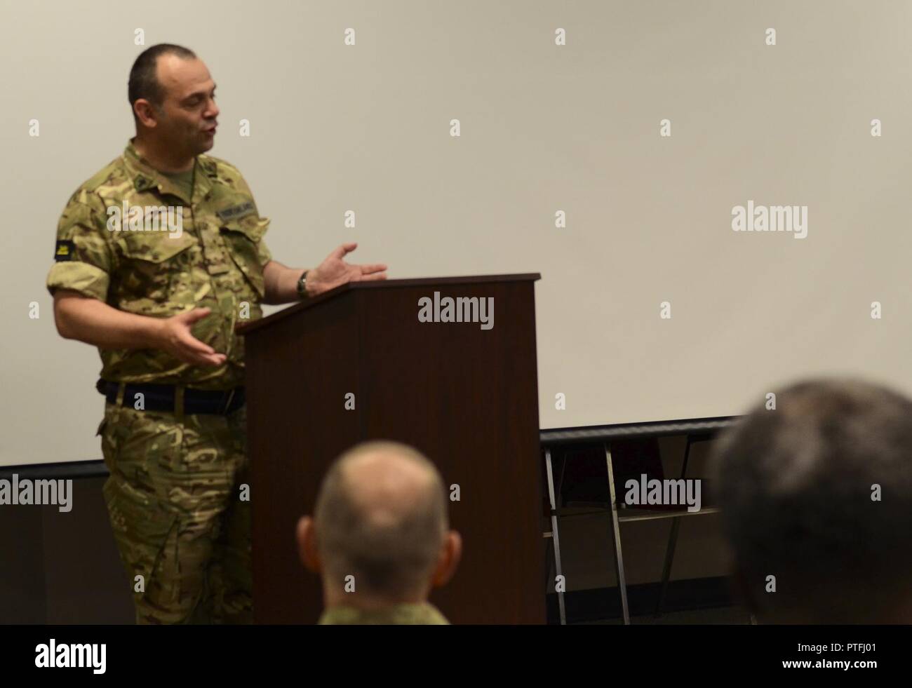 Padre Simon Rowlands gives the sermon during religious services to ...