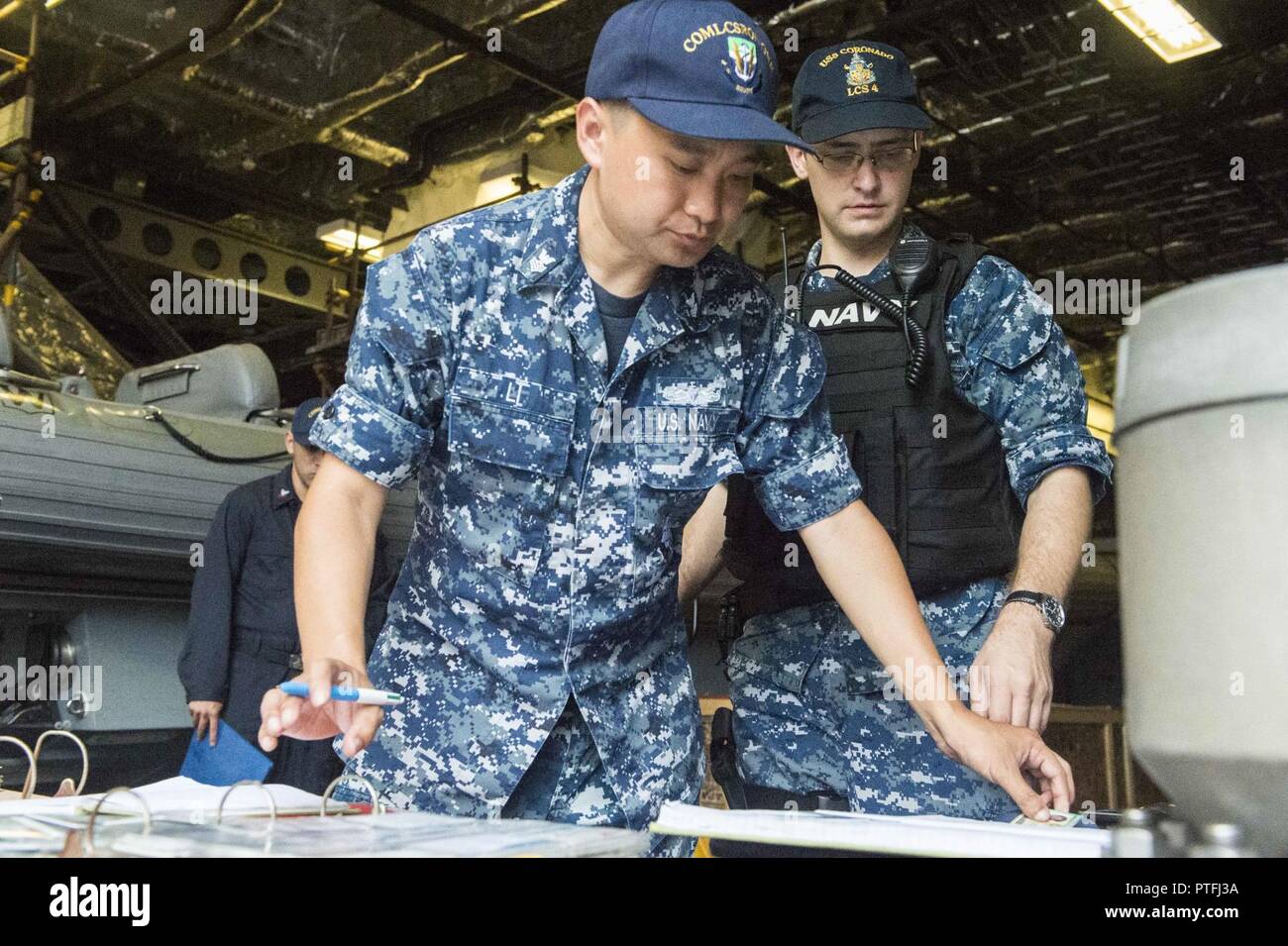 Fire Controlman 1st Class Scott Li, assigned to the reserve component ...