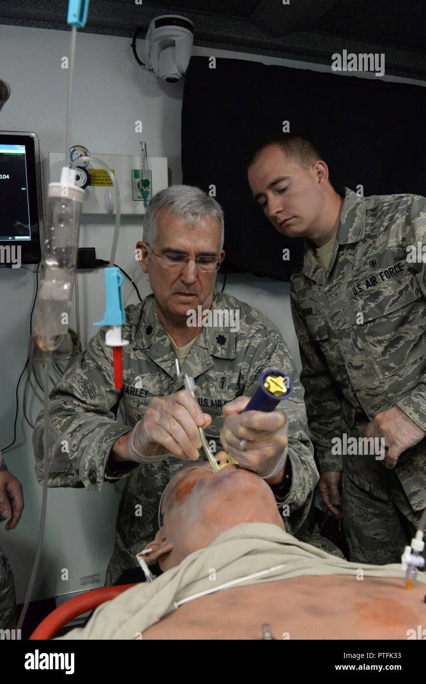 U.S. Air Force Lt. Col. Dwight Harley, left, inserts an endotracheal ...