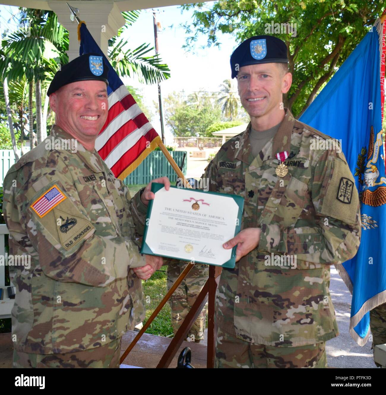 Lt. Col. James B. Cogbill (right) receives the Meritorious Service ...