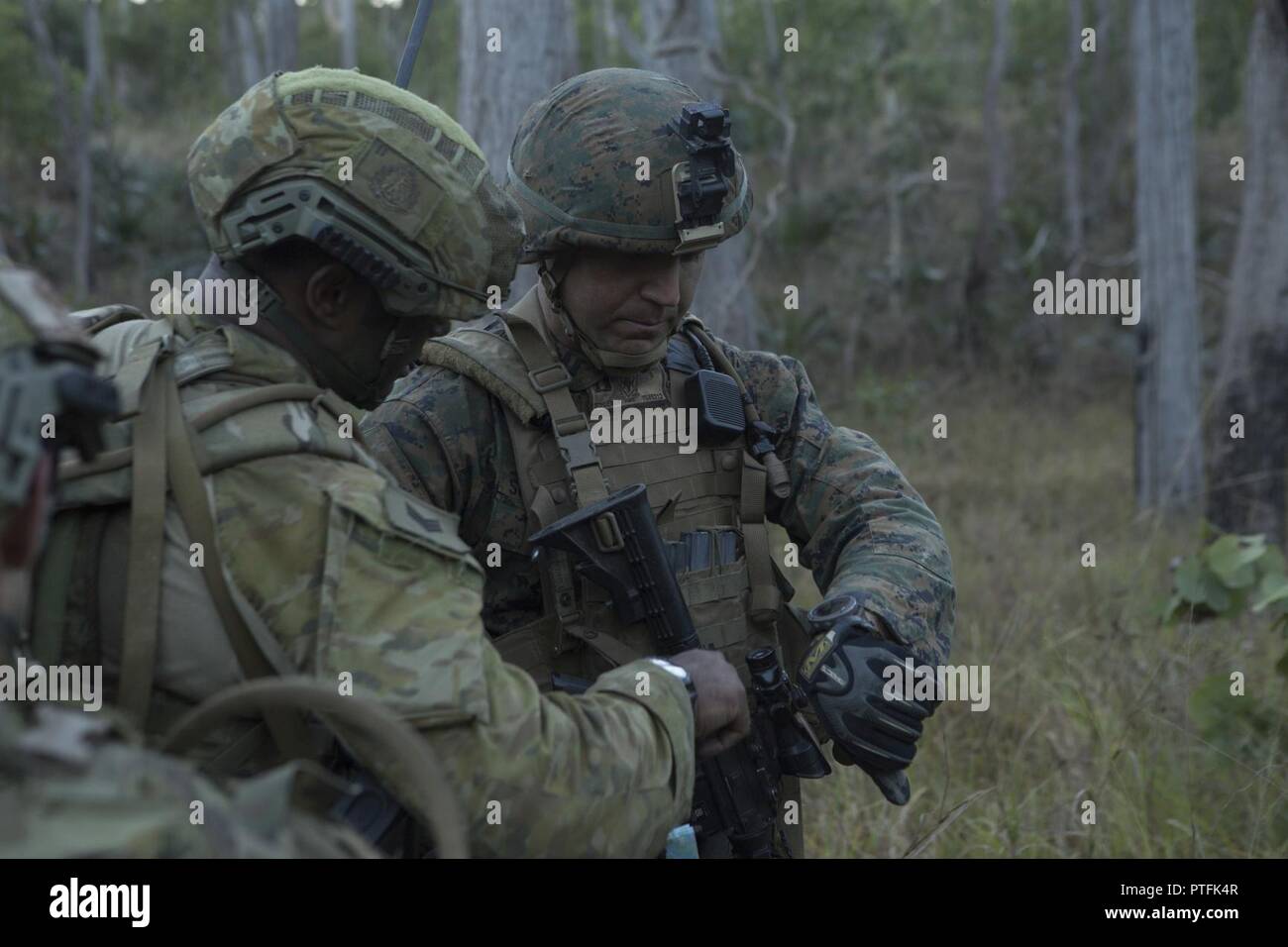 QUEENSLAND, Australia – U.S. Marine Capt. Thomas Schueman (right ...