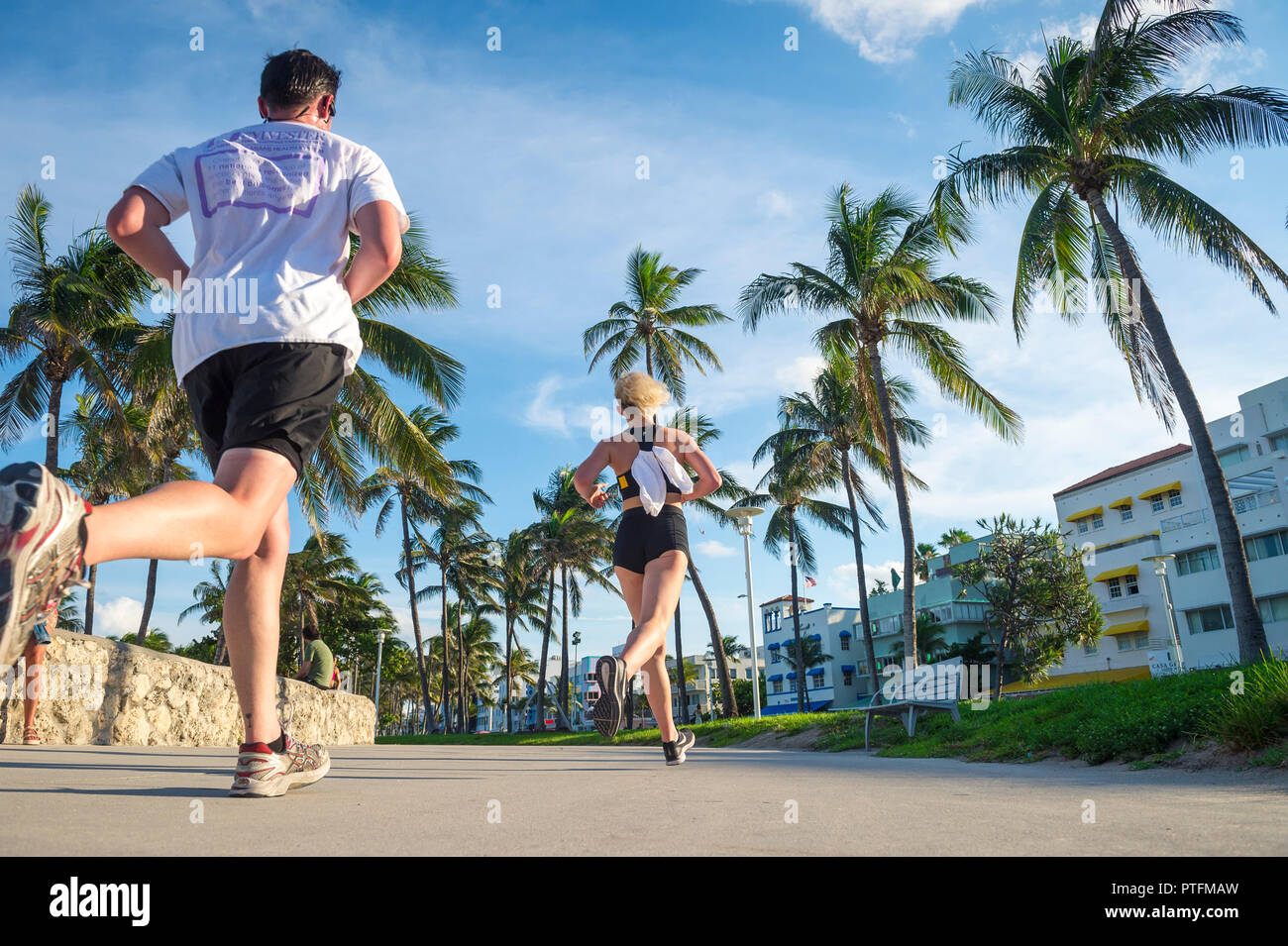 Man woman running exercise park hi-res stock photography and images - Alamy