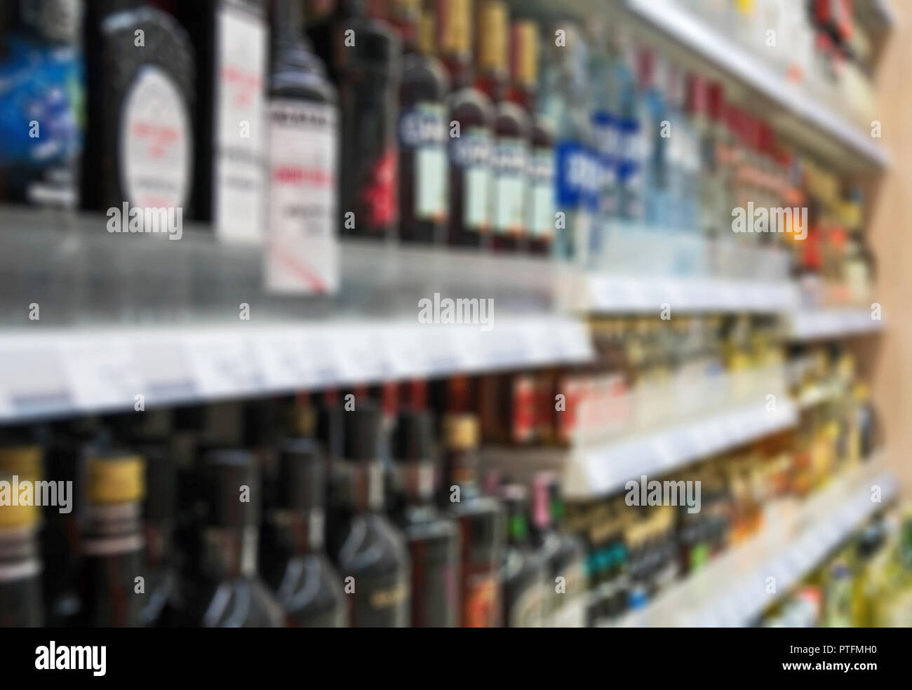 Blurred image of shelves with alcoholic drinks in supermarket Stock ...