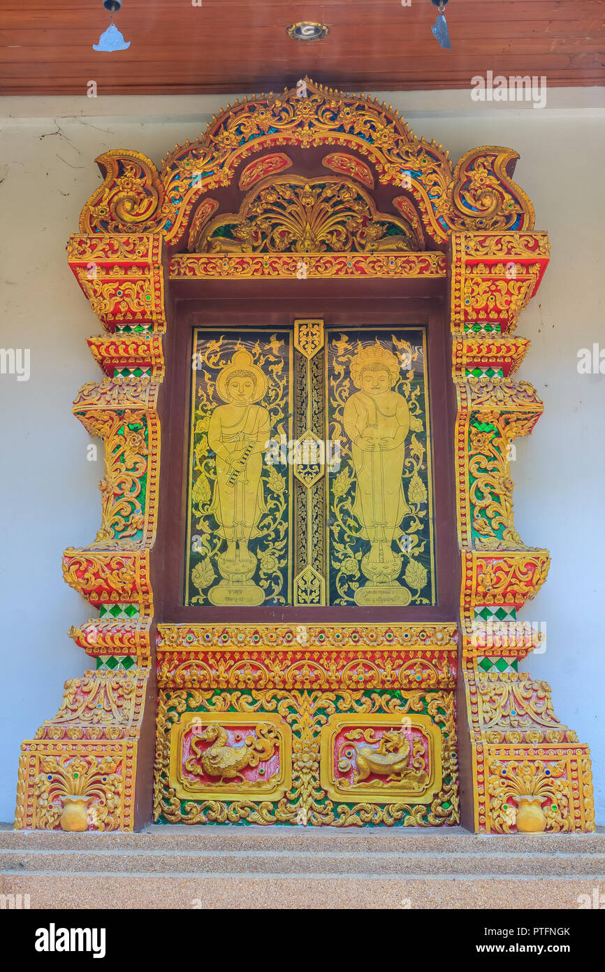 Beautiful Thai's style temple windows with golden craved buddha on the ...