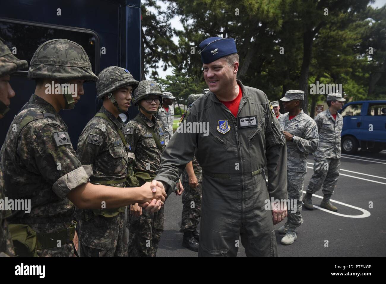 U.S. Air Force Col. David Shoemaker, 8th Fighter Wing commander, greets ...