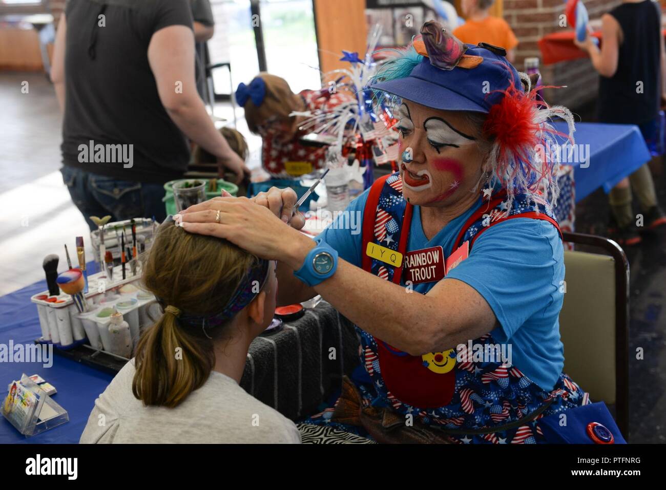 Donna Trout, also known as Rainbow Trout the clown, paints children’s ...