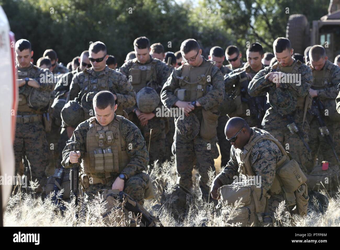 U.S. Marines from 3rd Battalion, 25th Marine Regiment, pause and take a moment of silence before ...