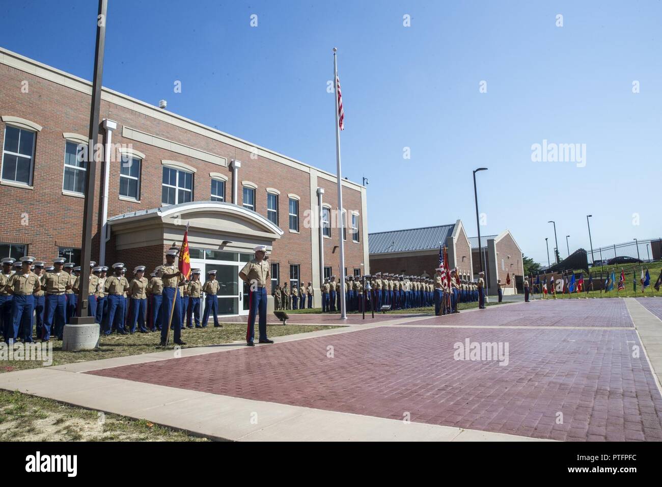 U.S. Marines stand at parade rest during a change of command ceremony ...