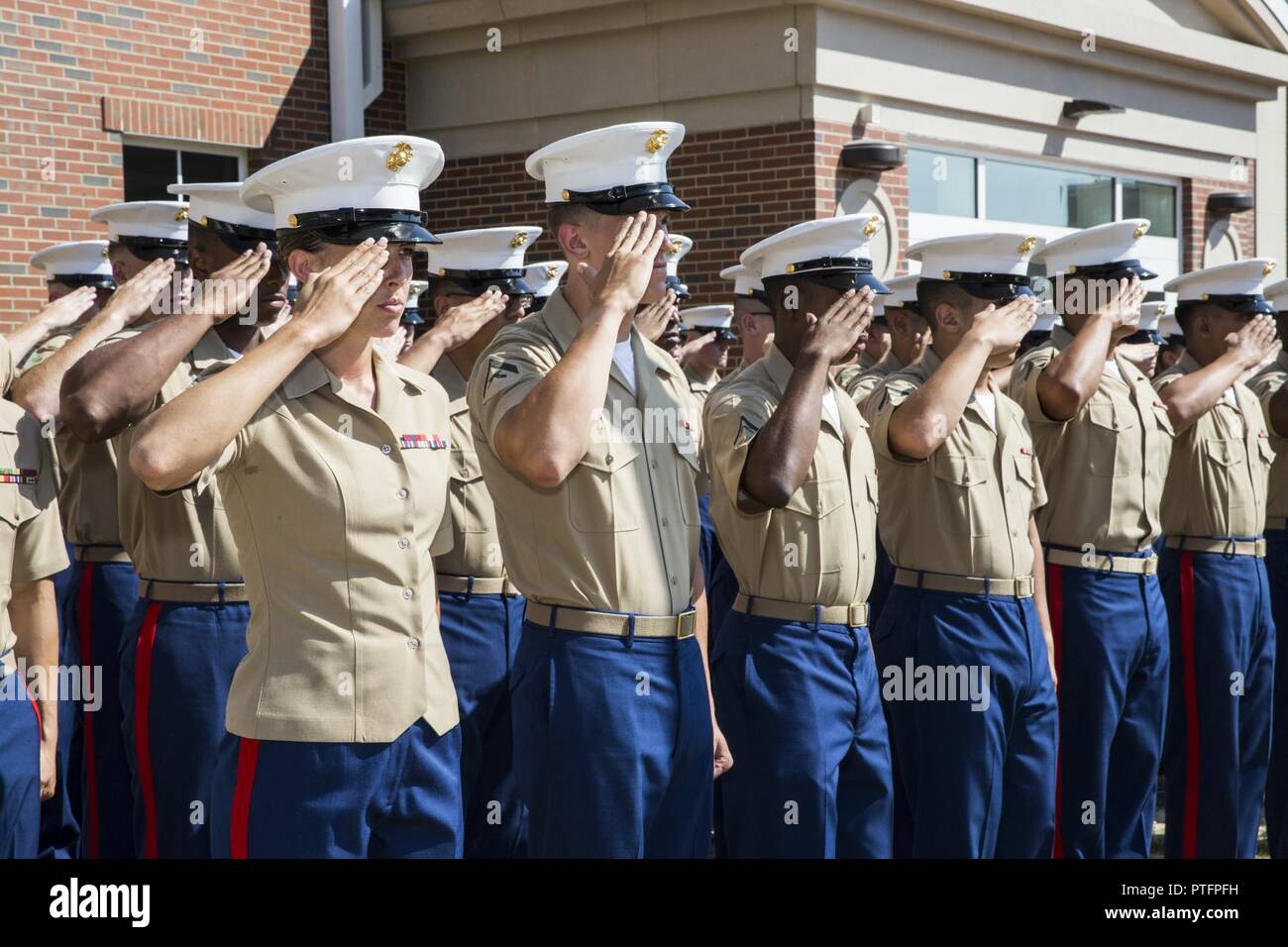 U.S. Marines salute during a change of command ceremony for Marine Corps Embassy Security Group ...