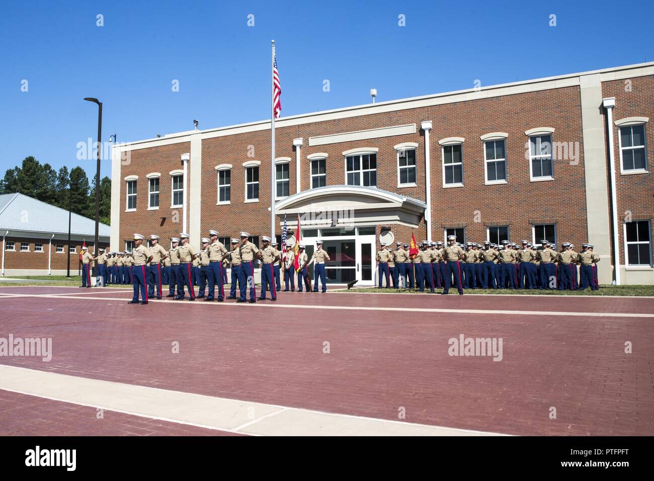 U.S. Marines stand at parade rest during a change of command ceremony ...