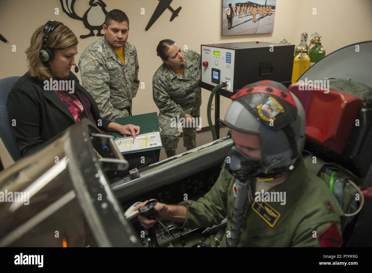 9th Physiological Support Squadron personnel monitor a pilot's vitals ...