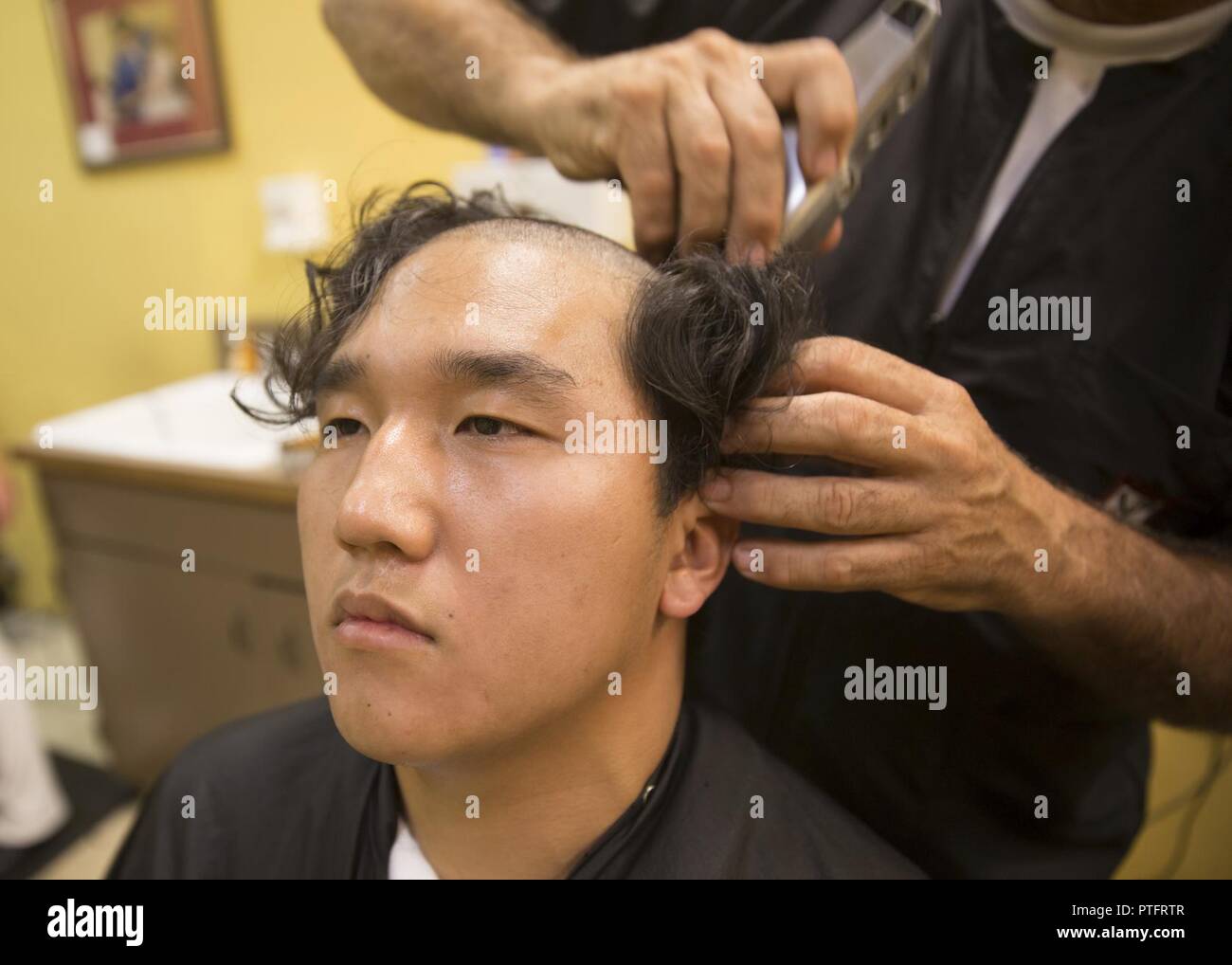 Soldier receiving a haircut hi-res stock photography and images - Alamy