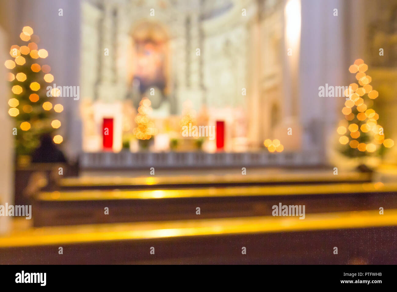 Defocused church interior blur abstract background with Christmas trees ...