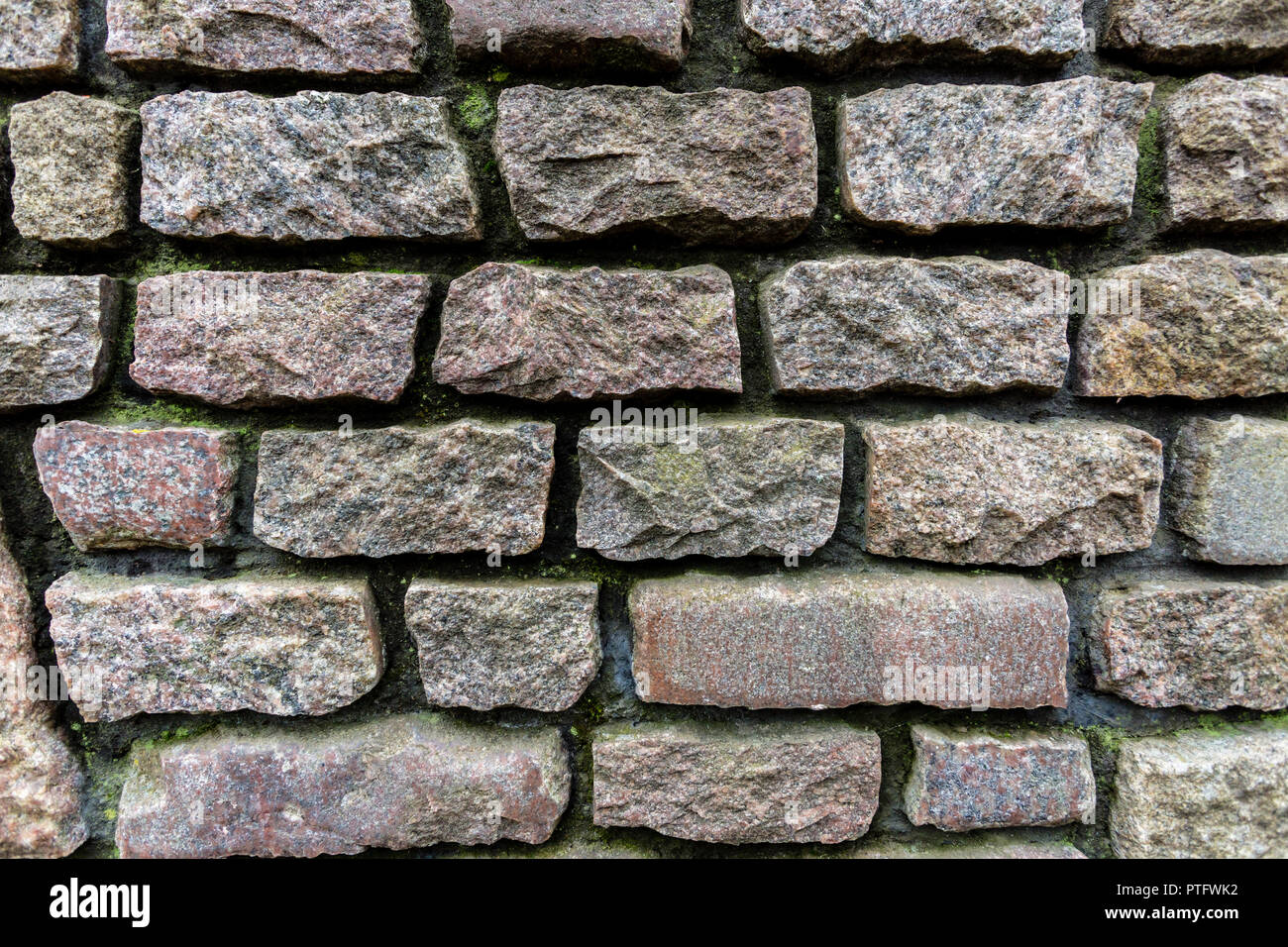 Granite masonry, rough gray stone wall, background Stock Photo - Alamy