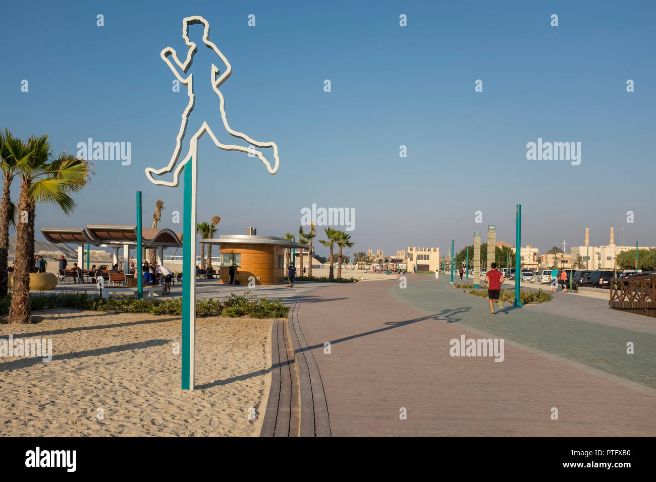 Sign indicating running track at the beach in the Jumeirah district of ...