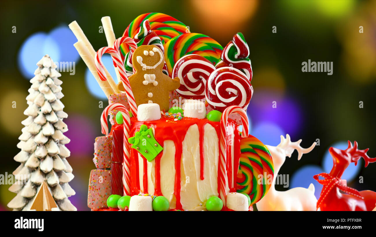 On trend festive candyland Christmas drip cake against festive ...
