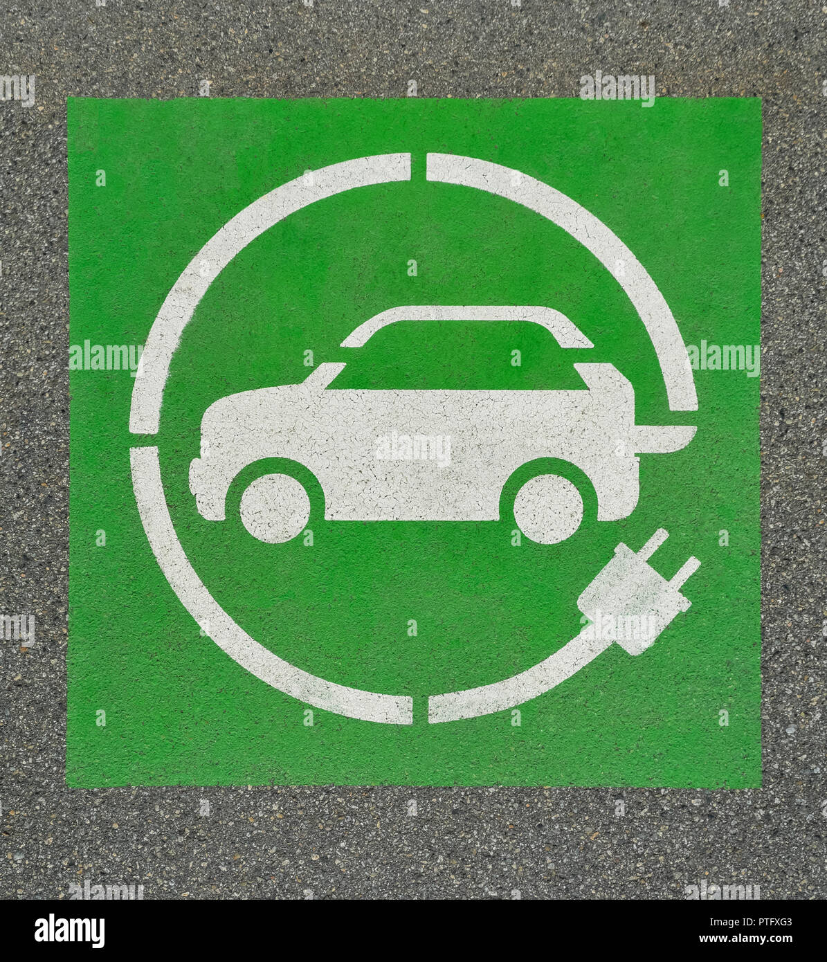 EV - electric vehicle charging station sign on asphalt. 'E' sign on ...