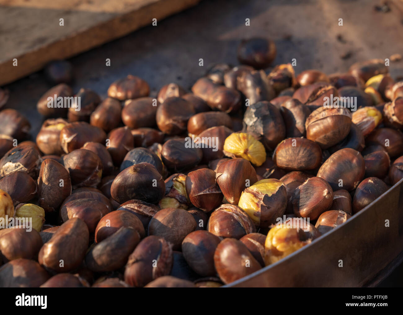 Roast chestnuts cooked over the red-hot grill,"Caldarroste", roasted ...
