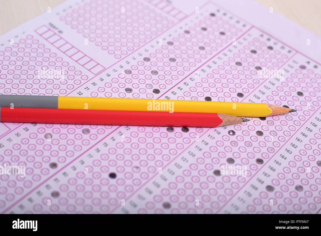 Picture of OMR sheet and two pencil. Isolated on the wooden background ...
