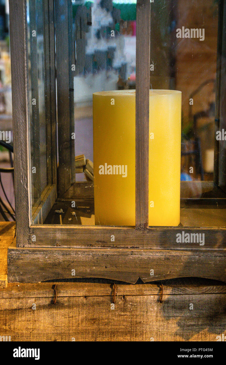 Thick candle protected by crystals inside a rustic lamp Stock Photo - Alamy
