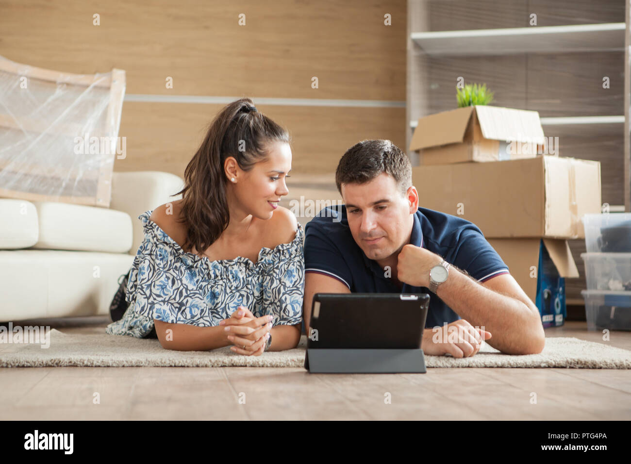 Wife and husband looking after things to buy for their new flat Stock ...