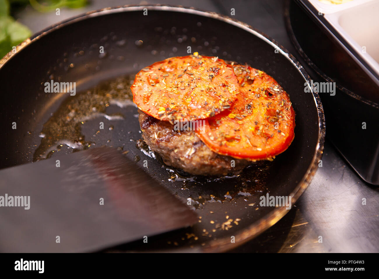 Burger making process hi-res stock photography and images - Alamy