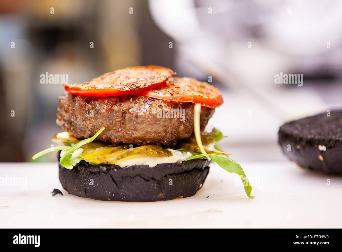 Fine burger dish made by chef cook. In restaurant kitchen Stock Photo ...