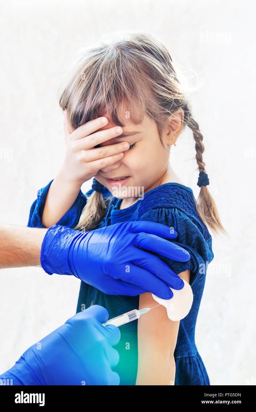 vaccination of children. An injection. Selective focus kids Stock Photo ...