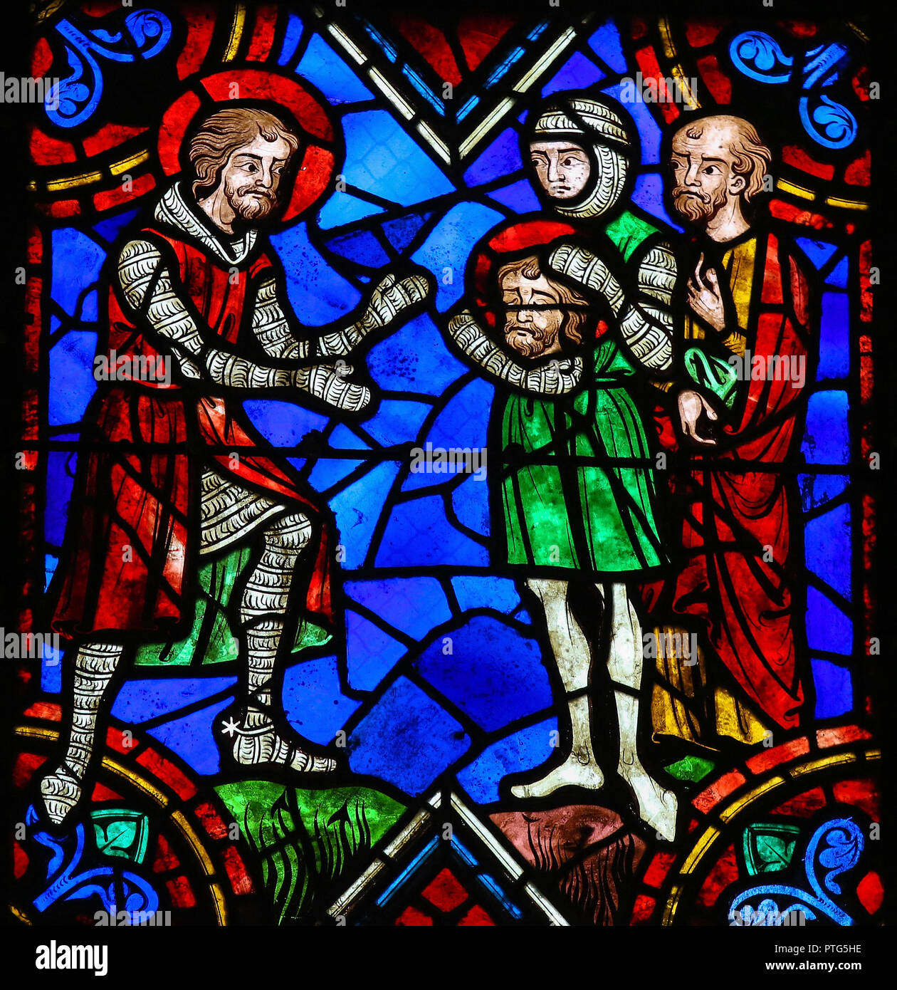 Stained glass window depicting Medieval Knights carrying the head of a ...
