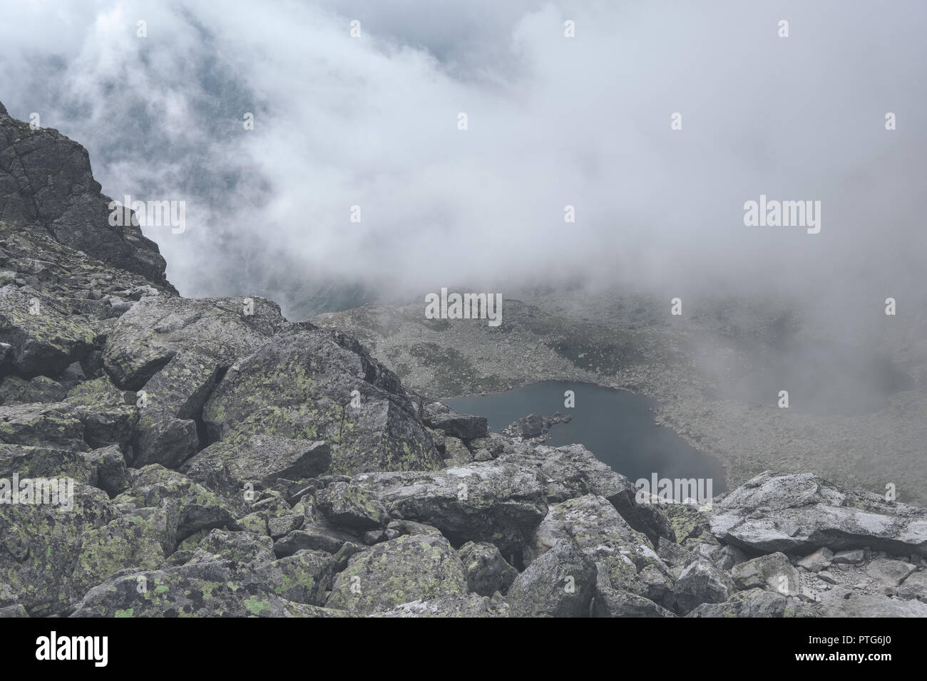 rocky sharp mountain tops in Tatra mountains in Slovakia with clouds ...