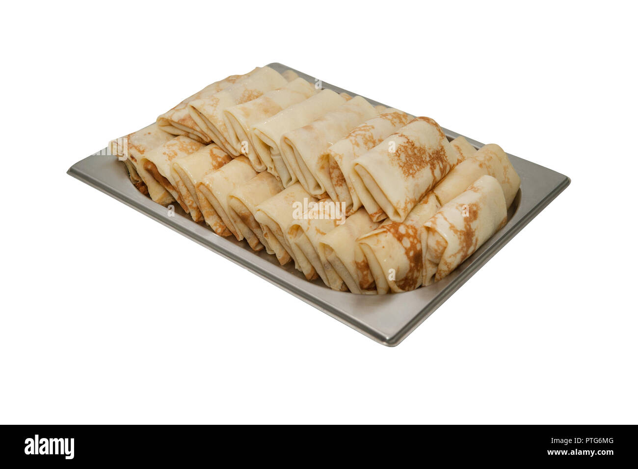 Pancakes on an iron tray on a white background Stock Photo - Alamy