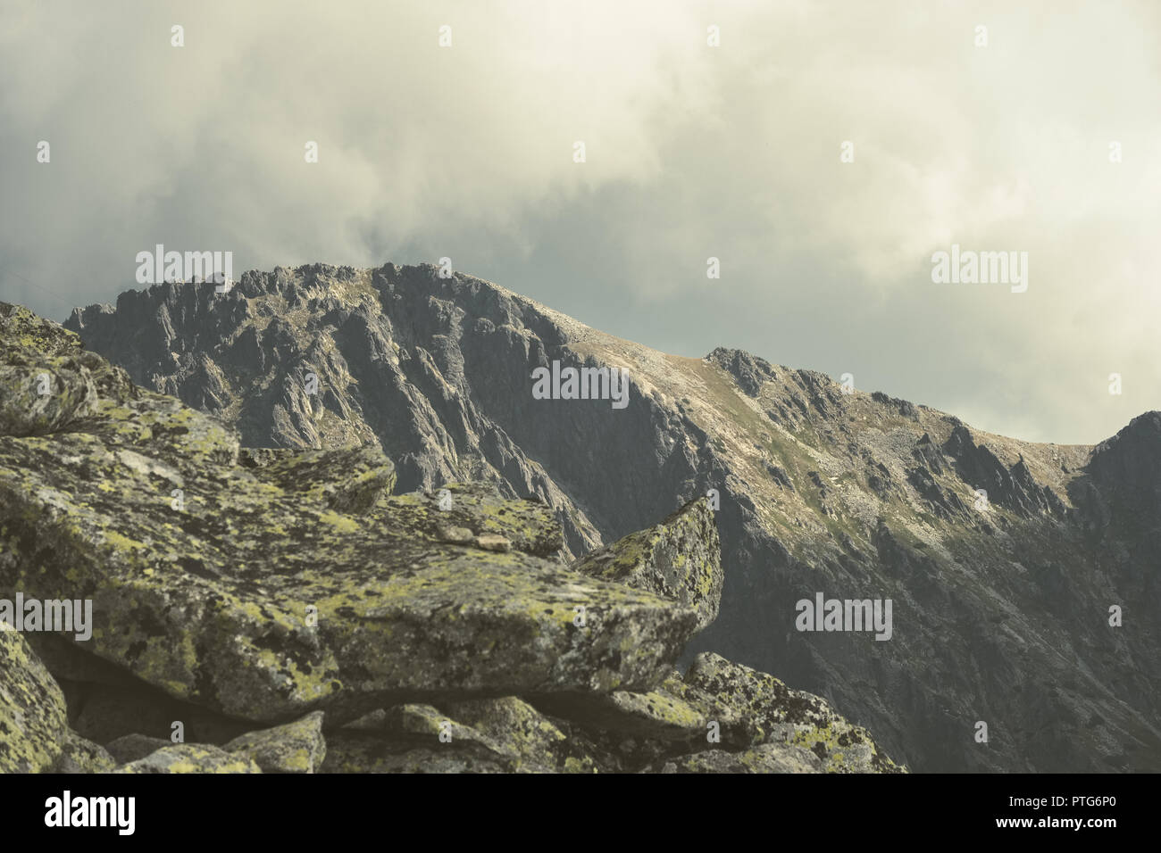rocky sharp mountain tops in Tatra mountains in Slovakia with clouds ...