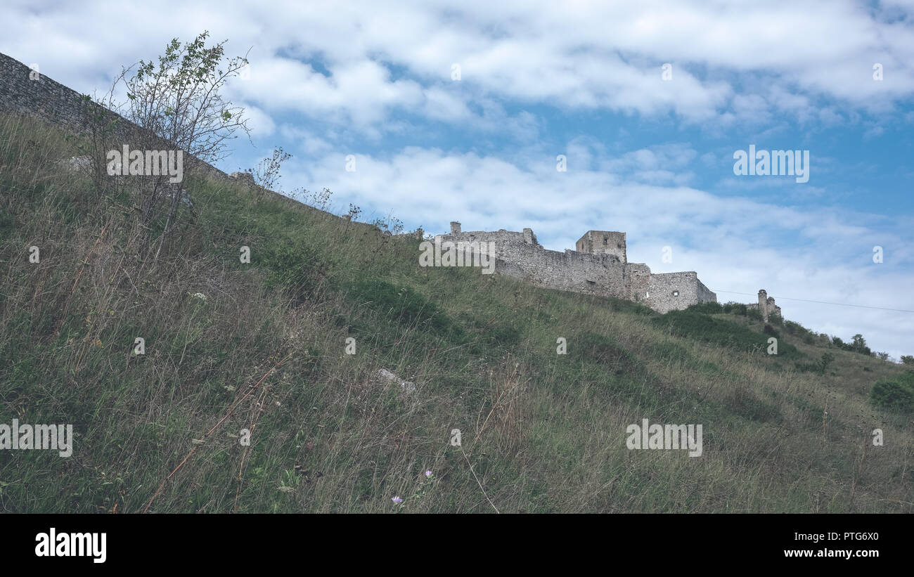 ruins of old abandoned castle on the cliff with bricks and stone ...