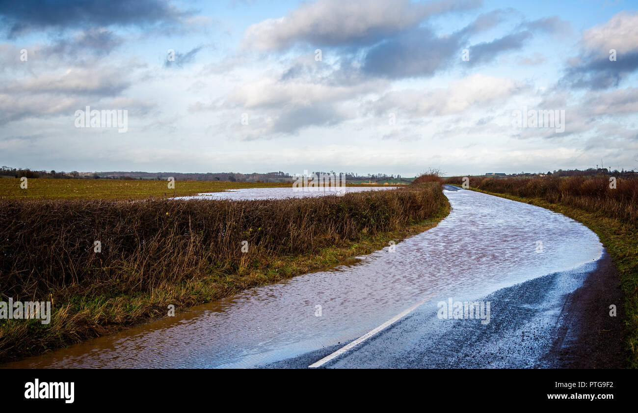Country road blocked due to flood water Stock Photo - Alamy
