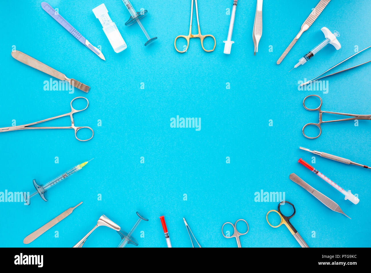 Flat lay of medical instruments on blue background. Mock up health care ...