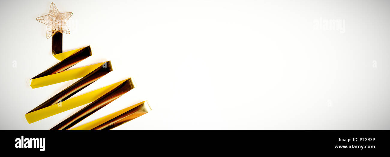 golden ribbon in a christmas tree shape Stock Photo - Alamy